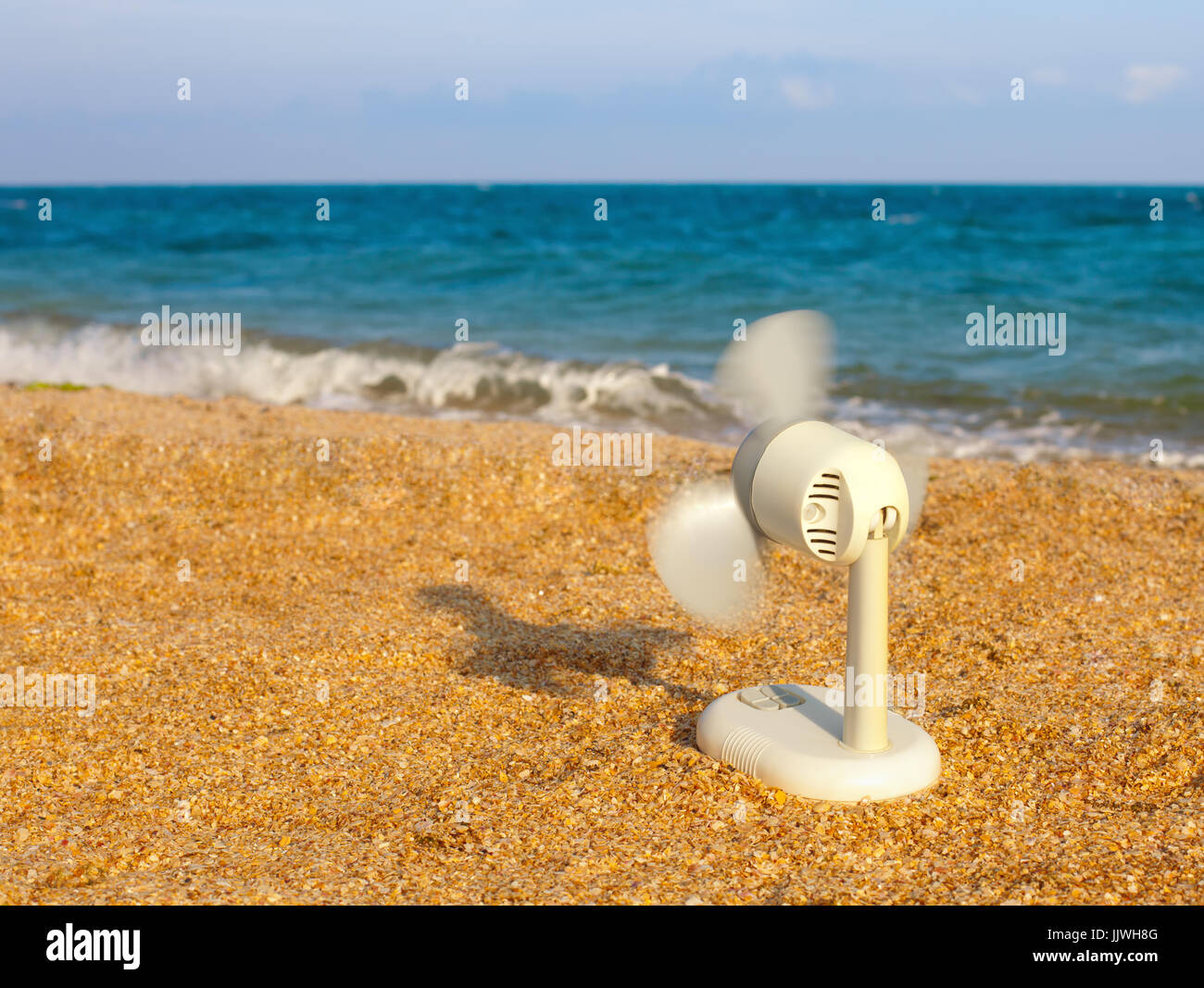 A fan on the beach Stock Photo - Alamy