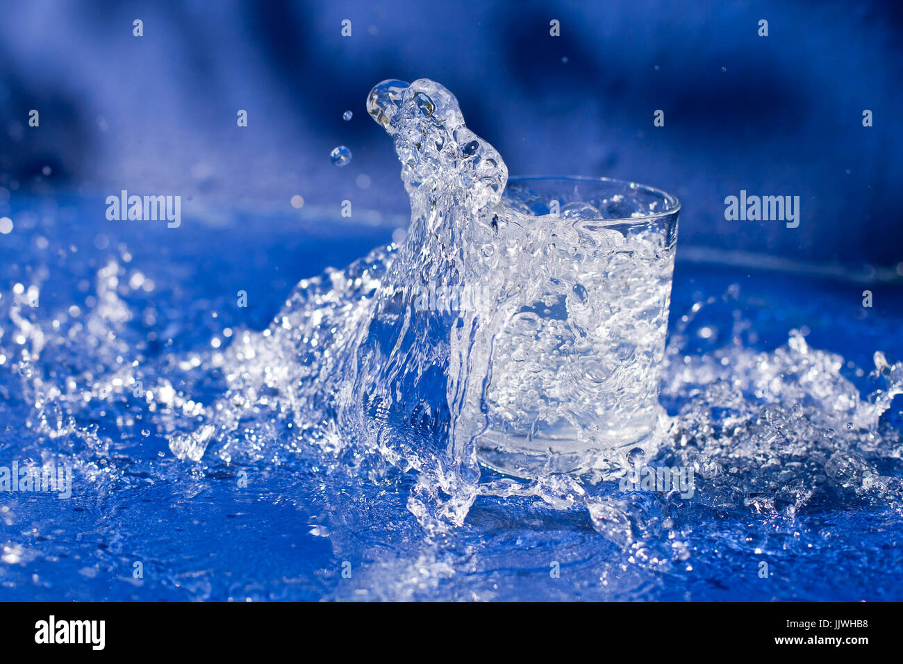 Splashing water from glass Stock Photo - Alamy