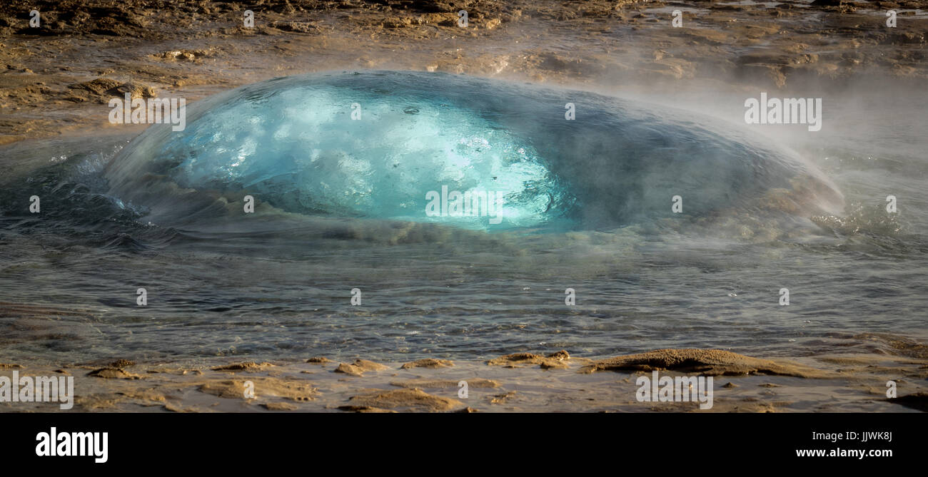 Geysir geyser bubble just about to erupt into tower of spray in Iceland ...