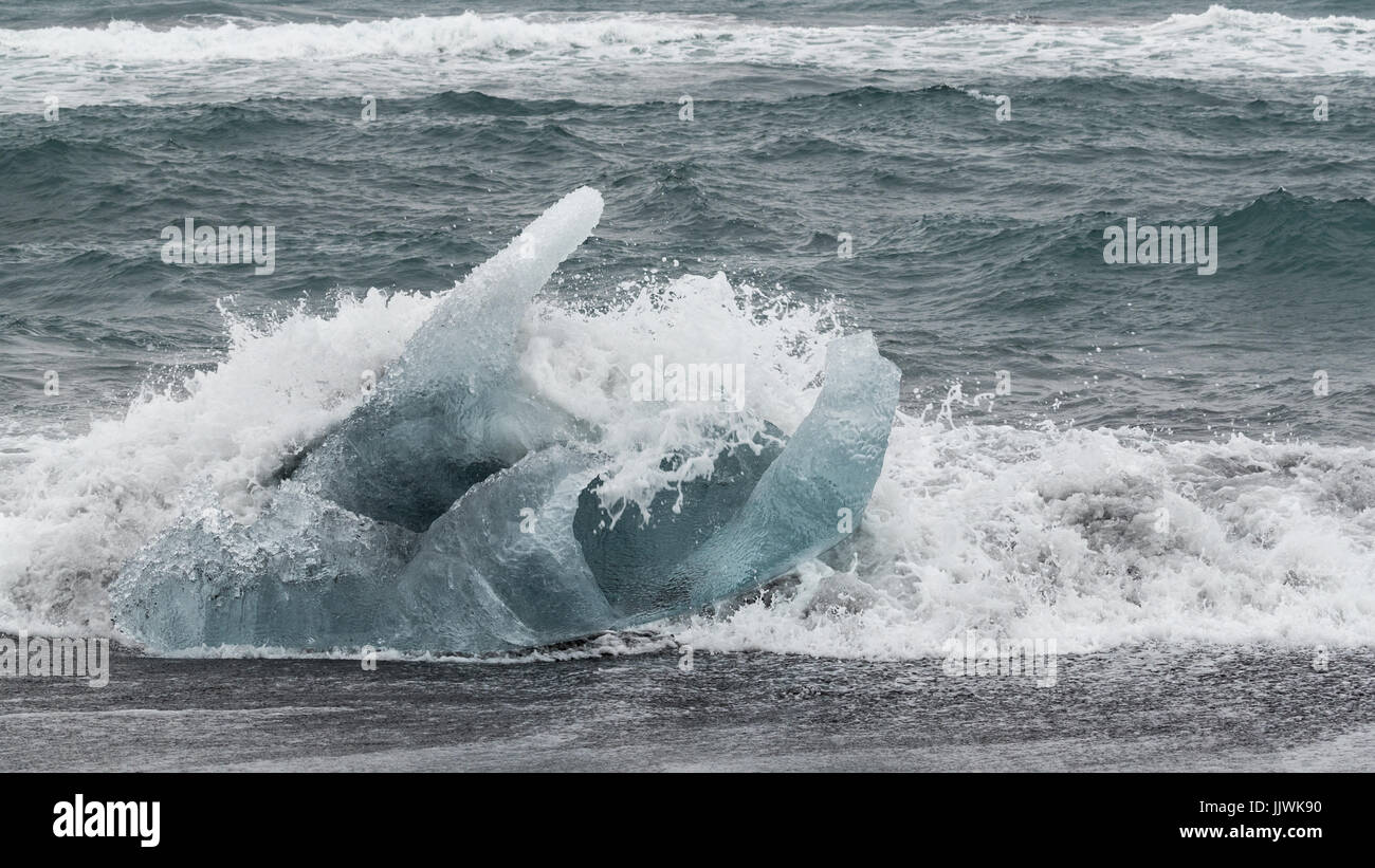 Hand shaped Iceberg on the beach at Jokulsarlon, diamond beach Stock ...