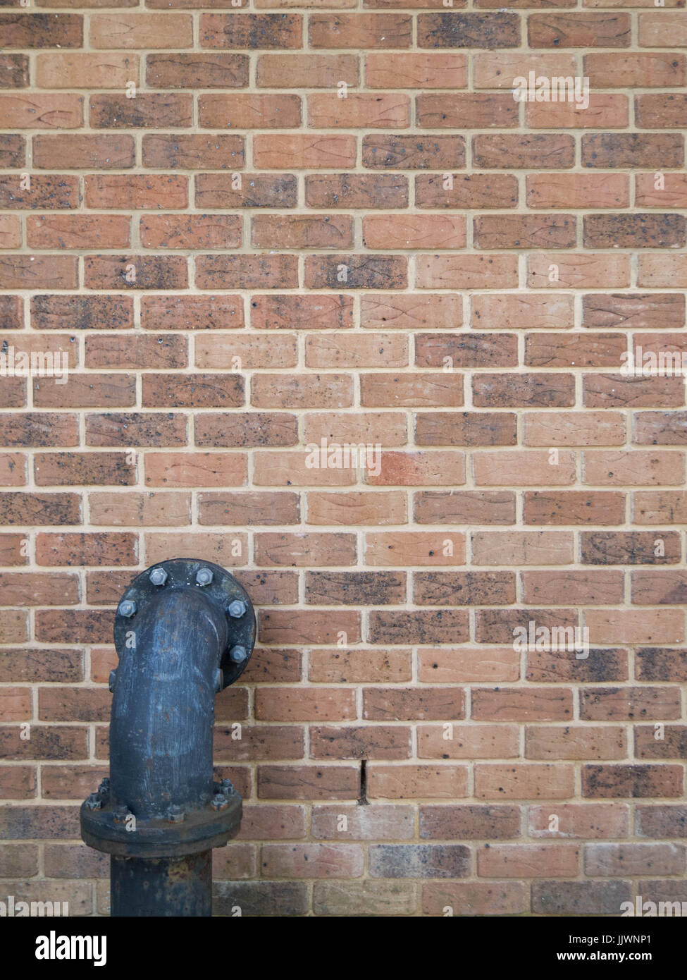 Pipe on brick wall hi-res stock photography and images - Alamy