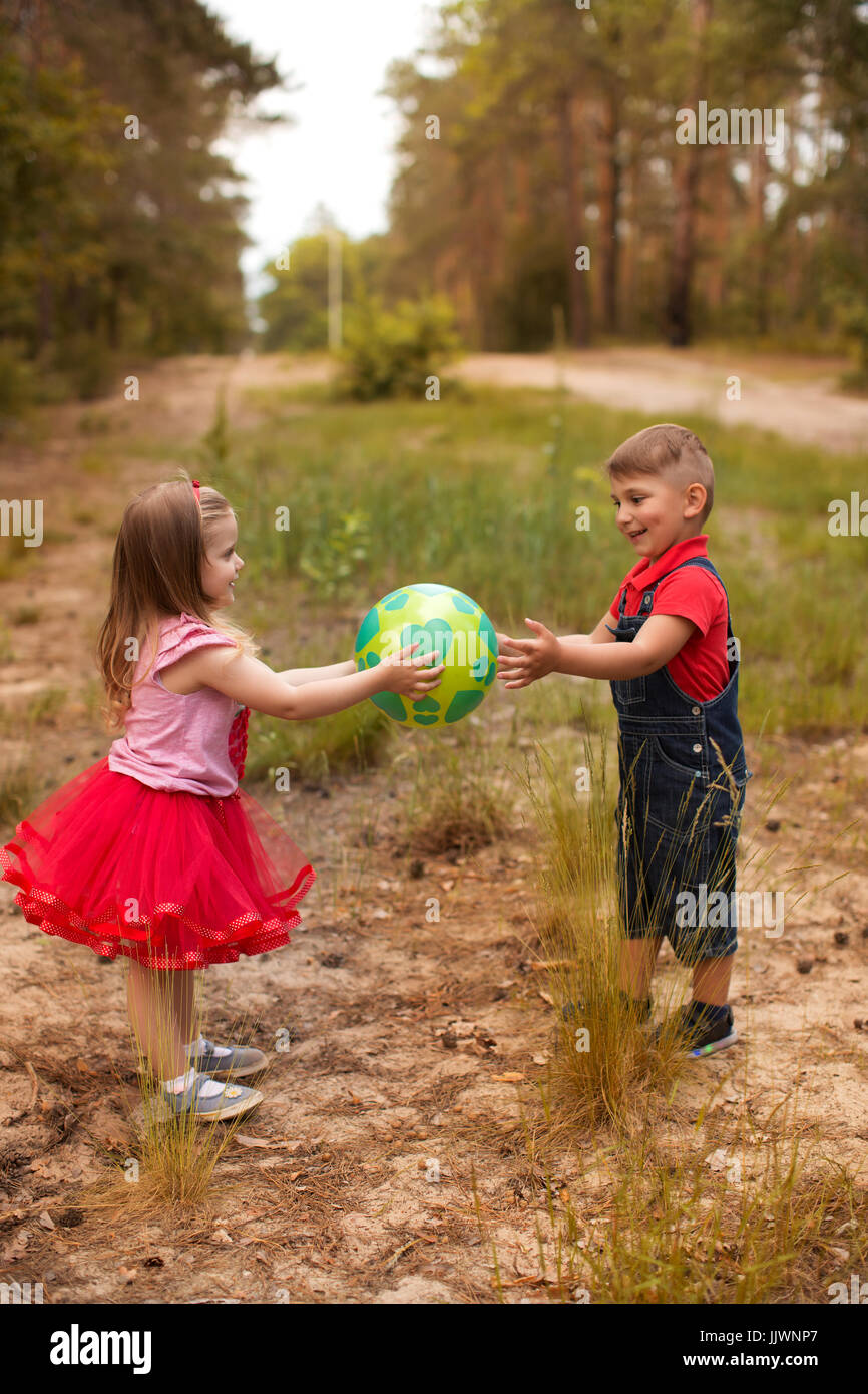 Funny children in the summer park Stock Photo - Alamy