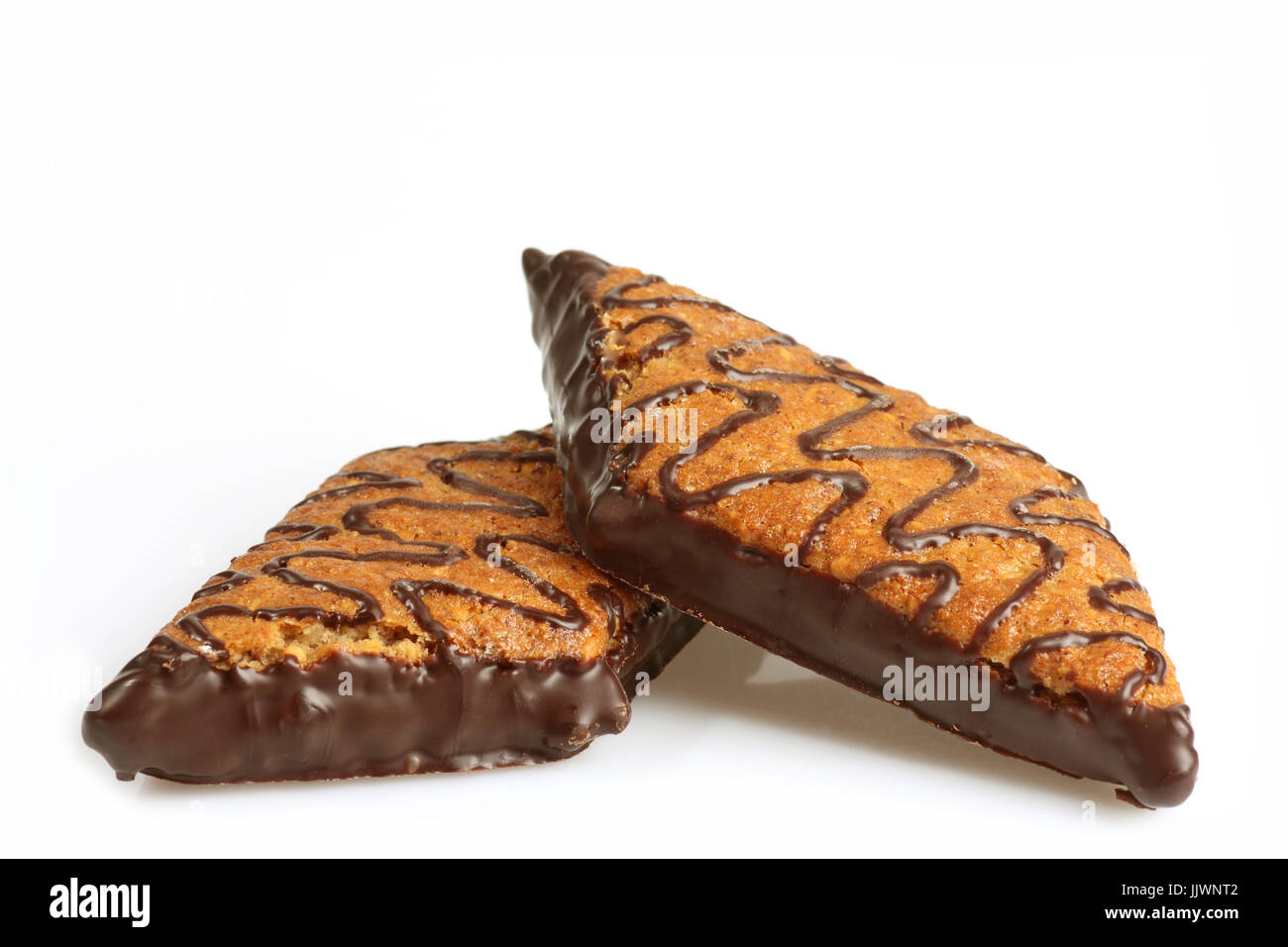 Crunchy sweet nut snack with chocolate on bright background Stock Photo ...