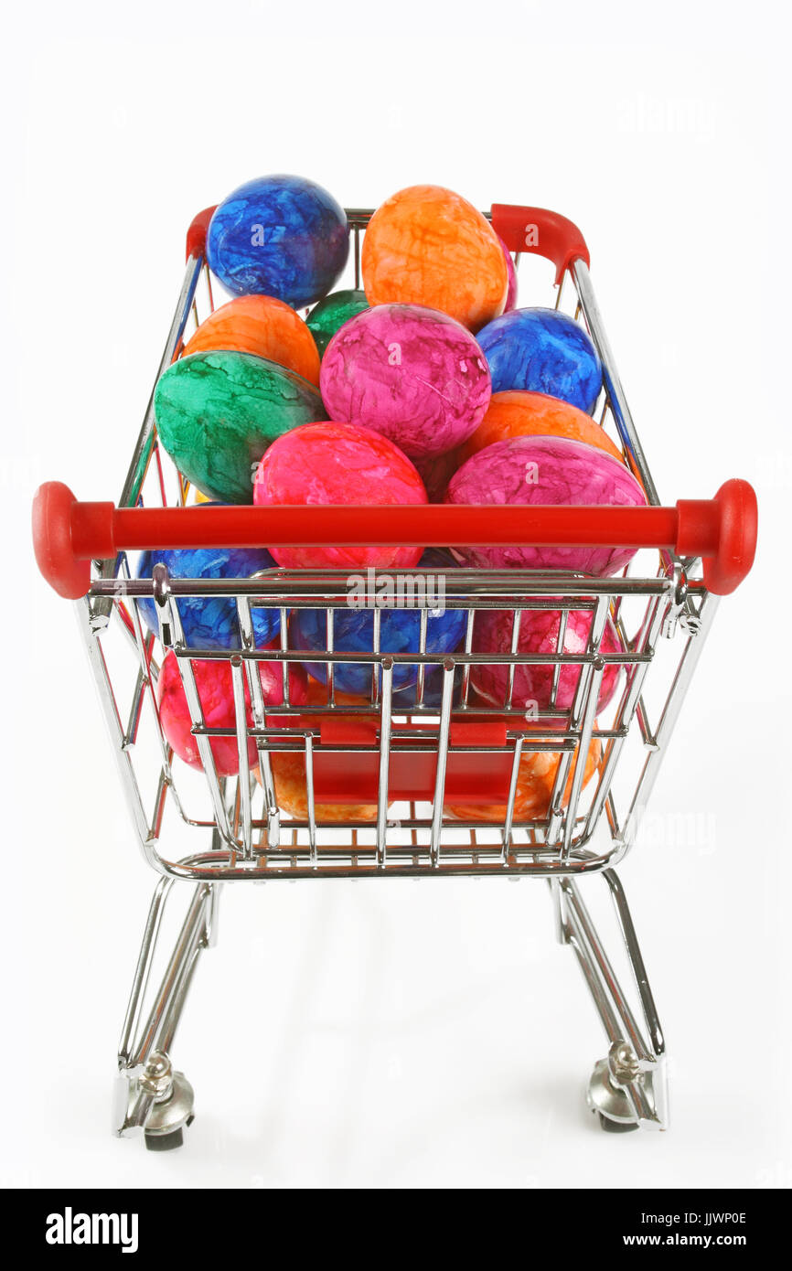 Colorful easter eggs in a shopping trolley on white background Stock ...