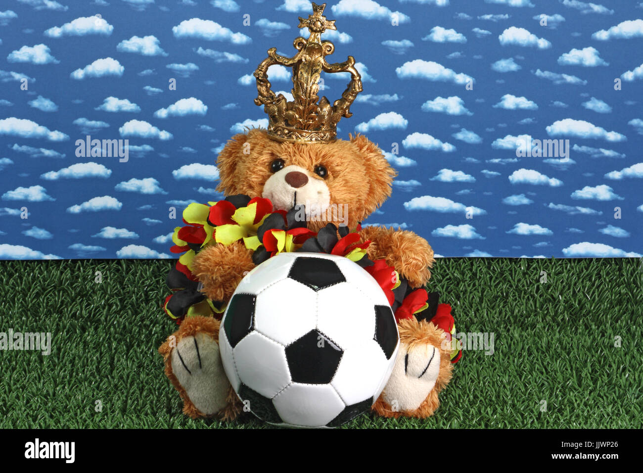 Cute teddy bear with a soccerball onb right background Stock Photo - Alamy