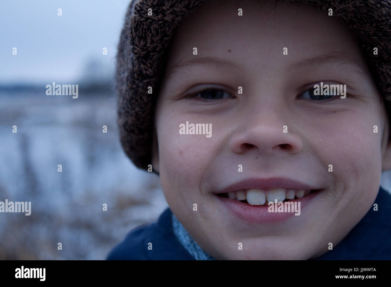 A smiling boy looking in the camera Stock Photo - Alamy