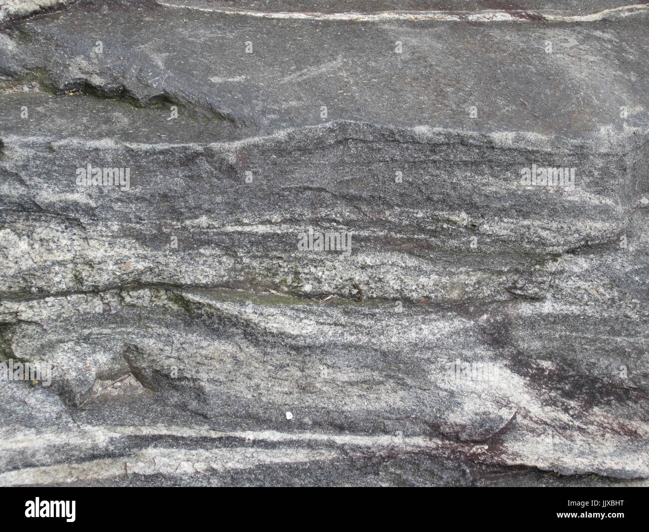 Gray and white striped textured rock background Stock Photo - Alamy