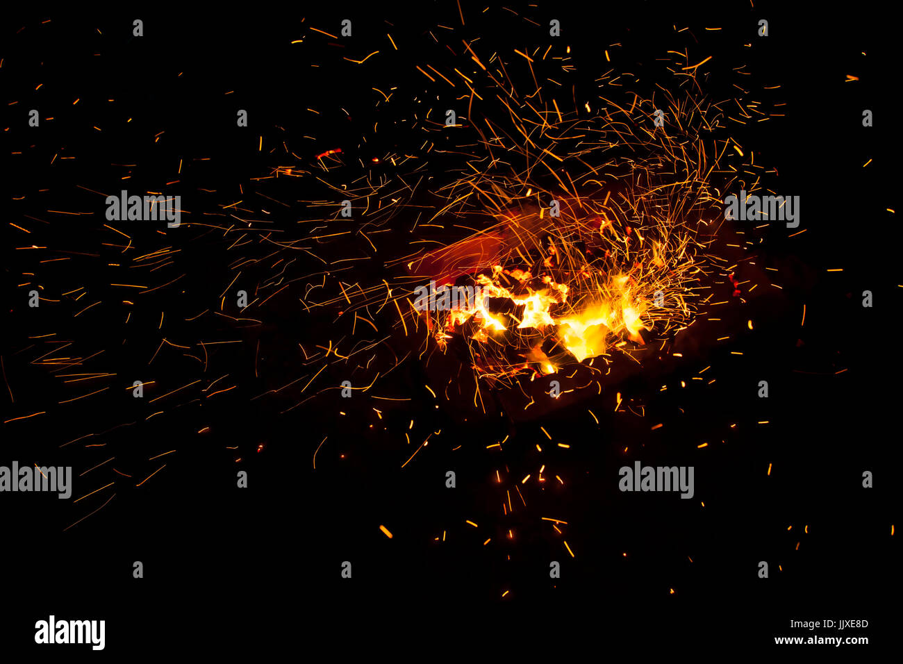 Hot sparking live-coals burning in a barbecue Stock Photo - Alamy