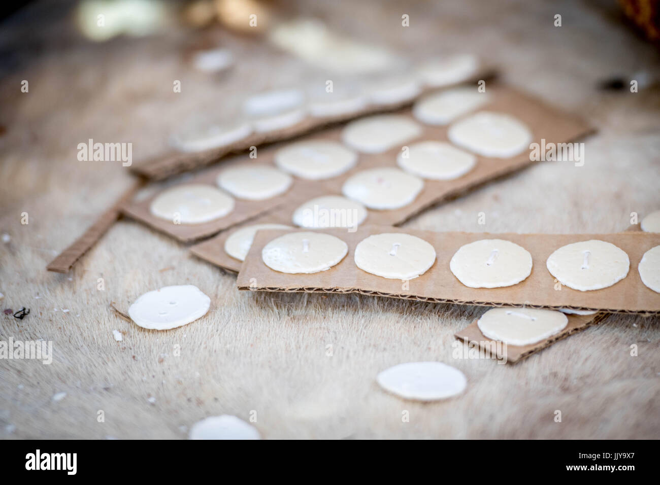 Buttons threaded onto cardboard at the Damara Living Museum in ...