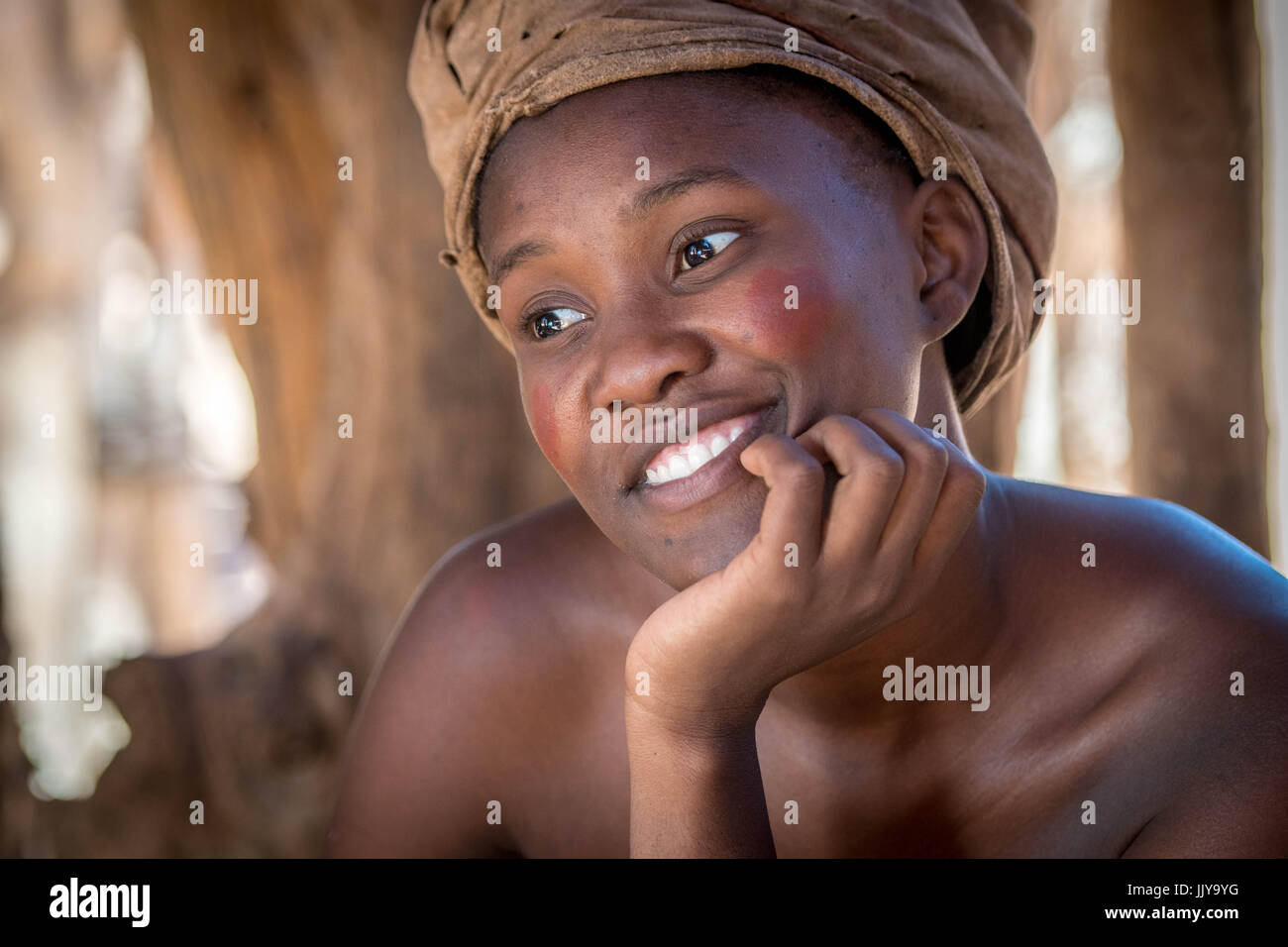 Damara woman poses for a photograph at theDamara Living Museum, located ...