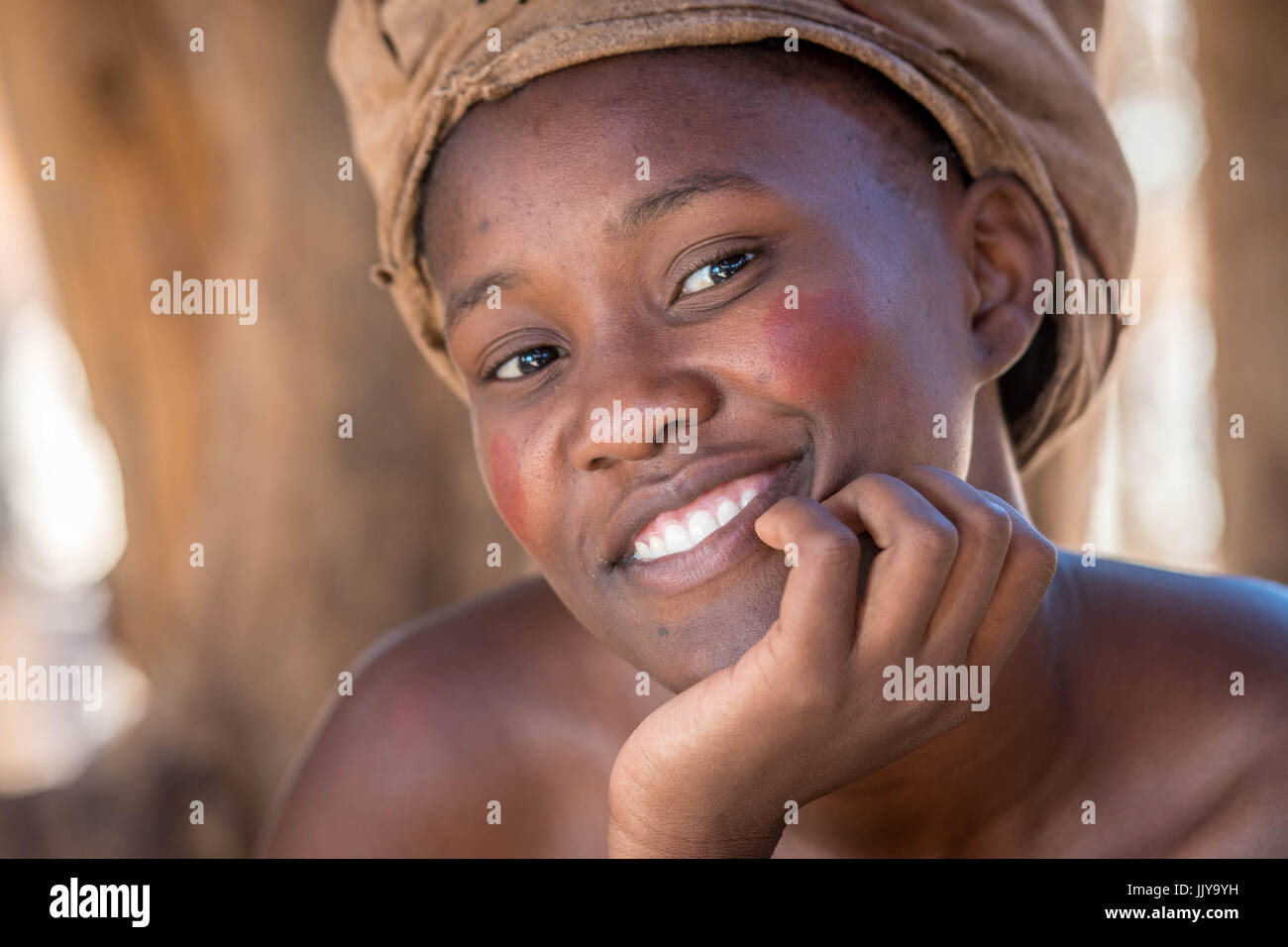 Damara woman poses for a photograph at the Damara Living Museum ...