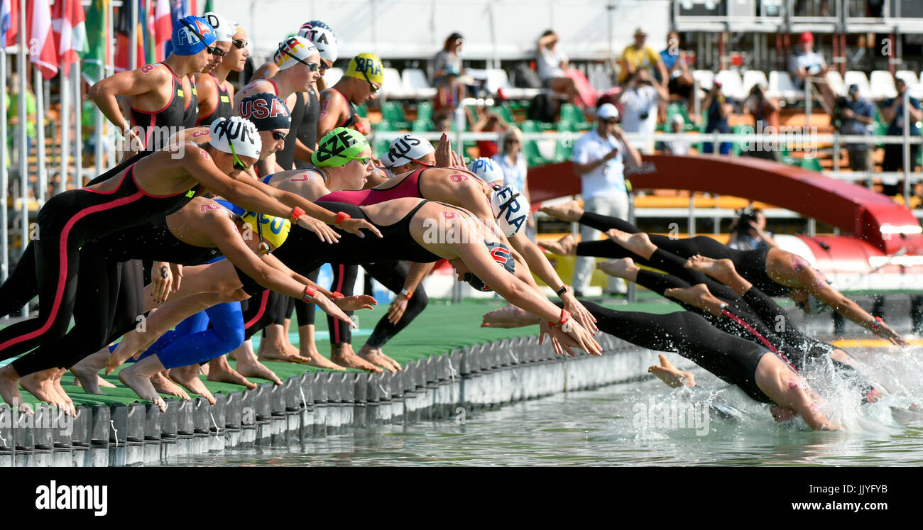 Swimmers start the women's 25km open water swimming competition, part ...