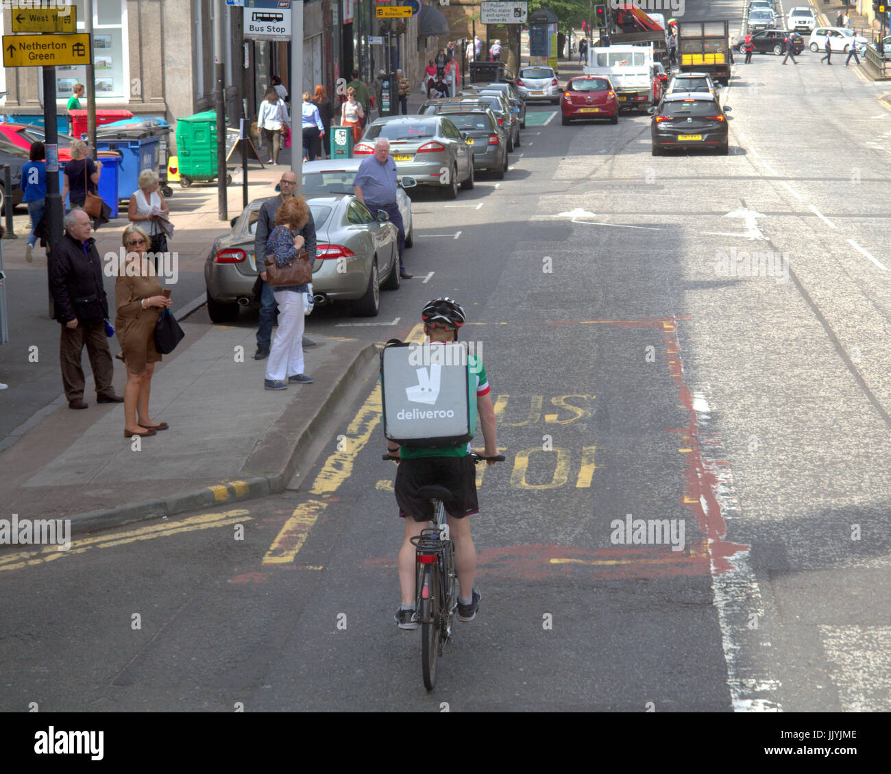 young man boy delivery bike cyclist Deliveroo food delivery delivering ...
