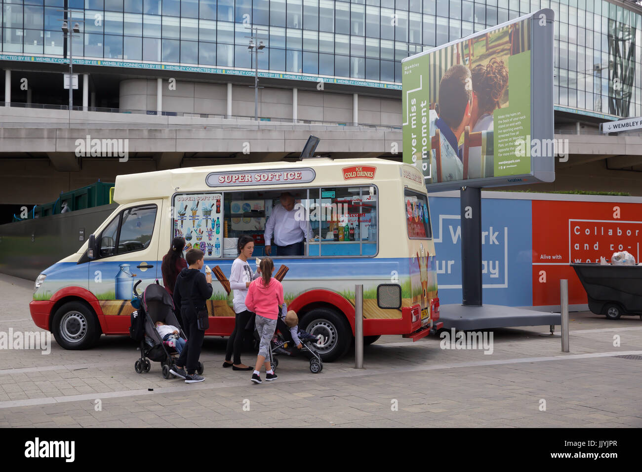 Wembley Park, UK. 21st July, 2017. Family enjoy an ice cream from a van ...