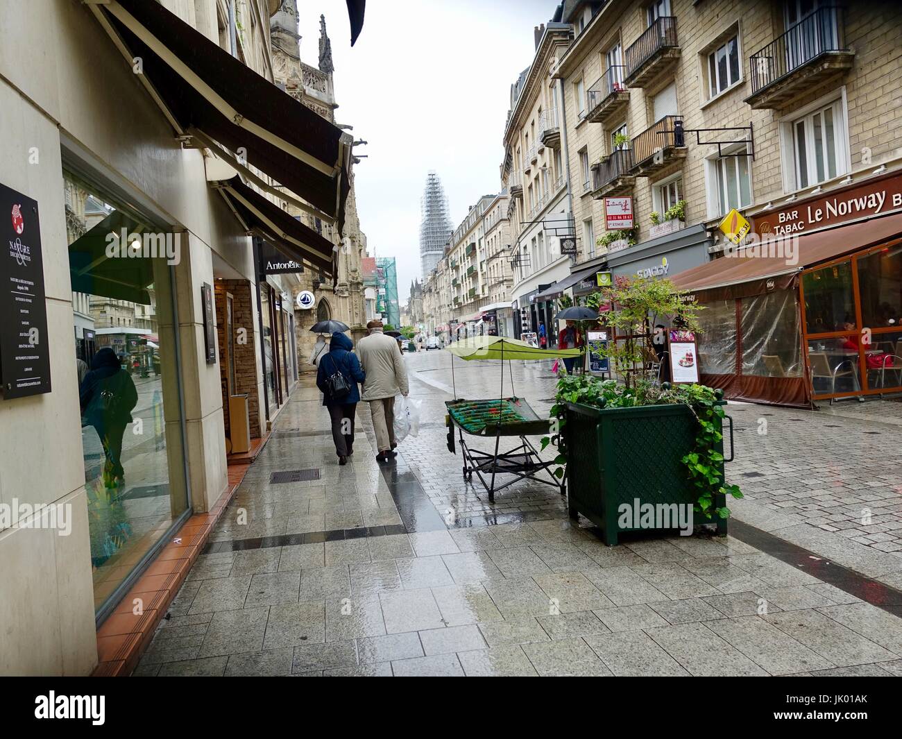 Pedestrians street in light rain. Caen, Calvados, Normandy, France ...