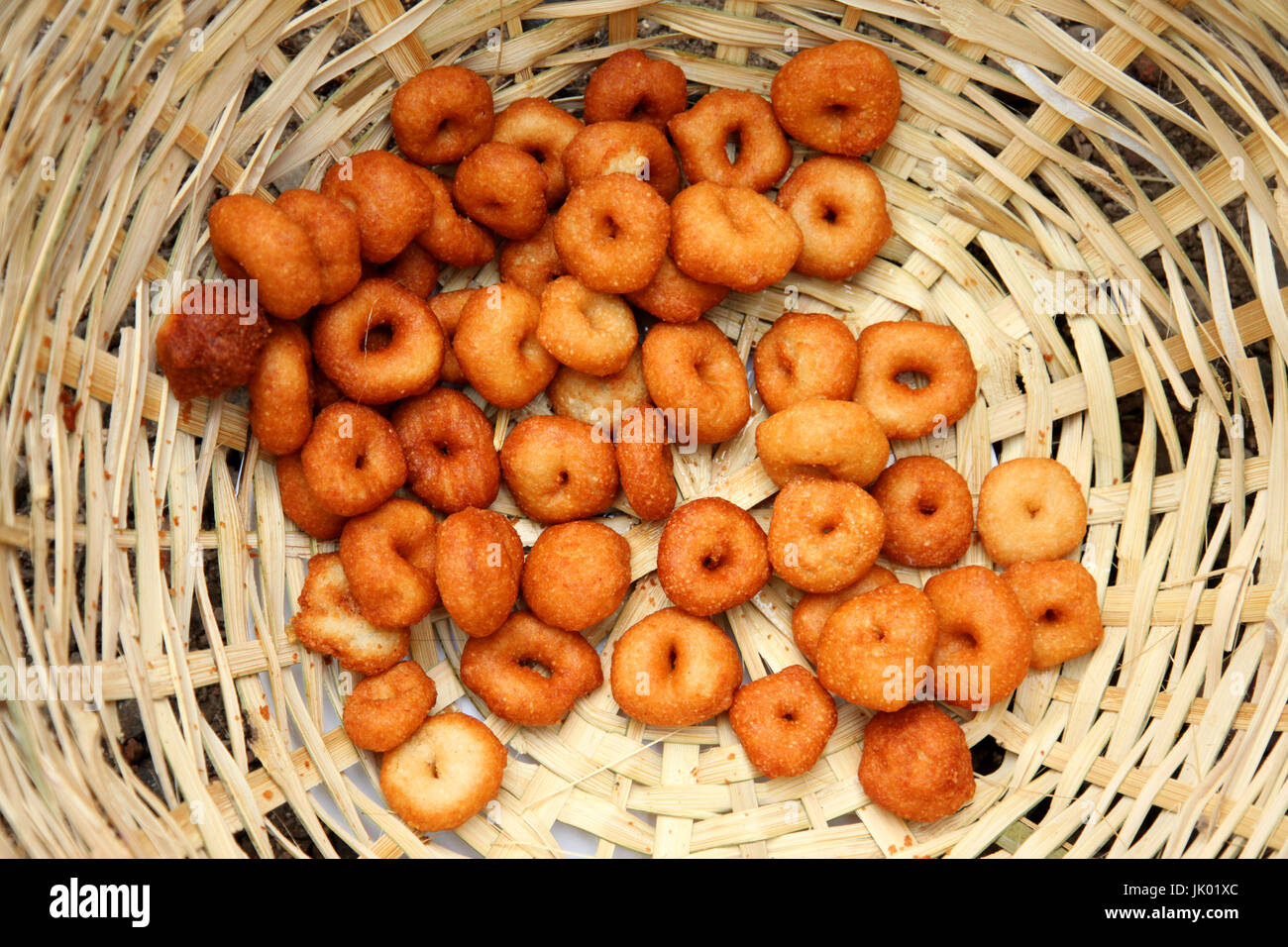 Deep frying medu vada in the pan. Medu Vada is a savoury snack from ...