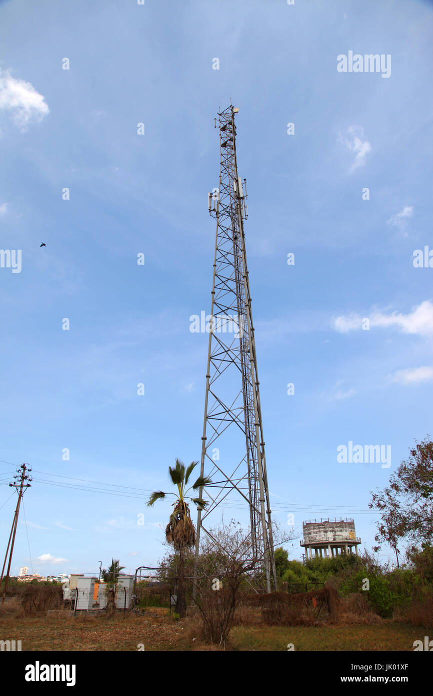 Mobile phone communication tower transmission signal with blue sky and ...