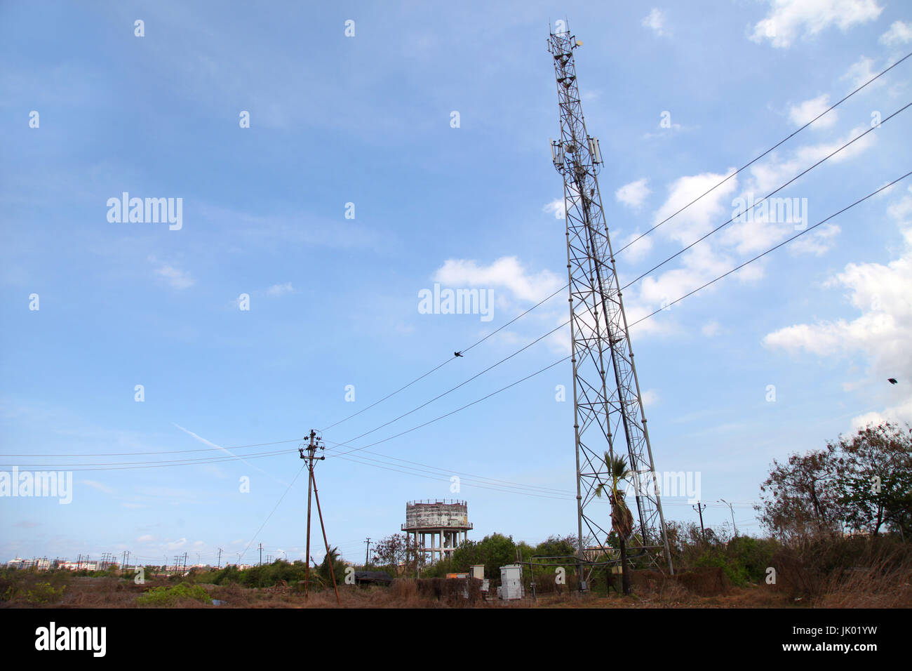 Mobile phone communication tower transmission signal with blue sky and ...