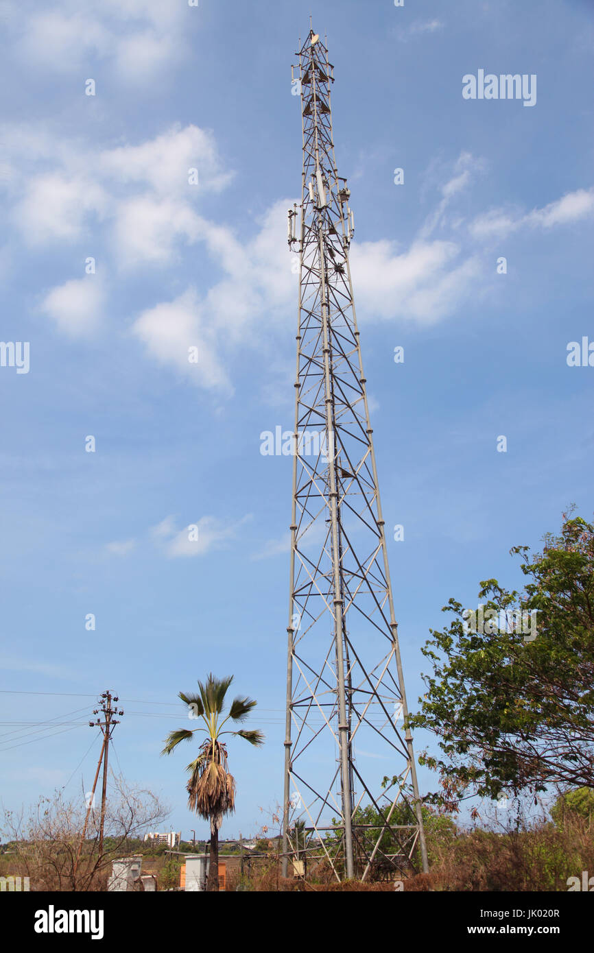 Mobile phone communication tower transmission signal with blue sky and ...