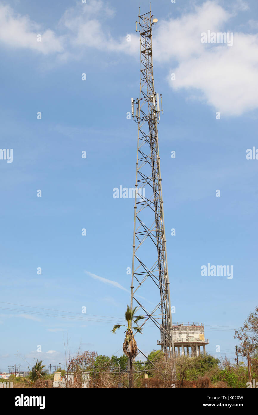 Mobile phone communication tower transmission signal with blue sky and ...