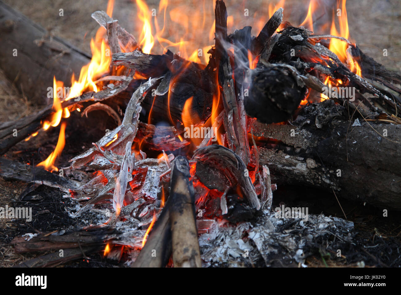 Burning firewood in the fireplace close up Stock Photo - Alamy