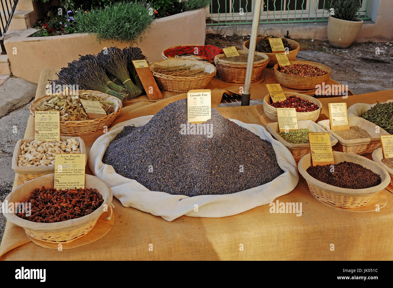Market stall with dried Lavender blossoms and different kinds of spices ...