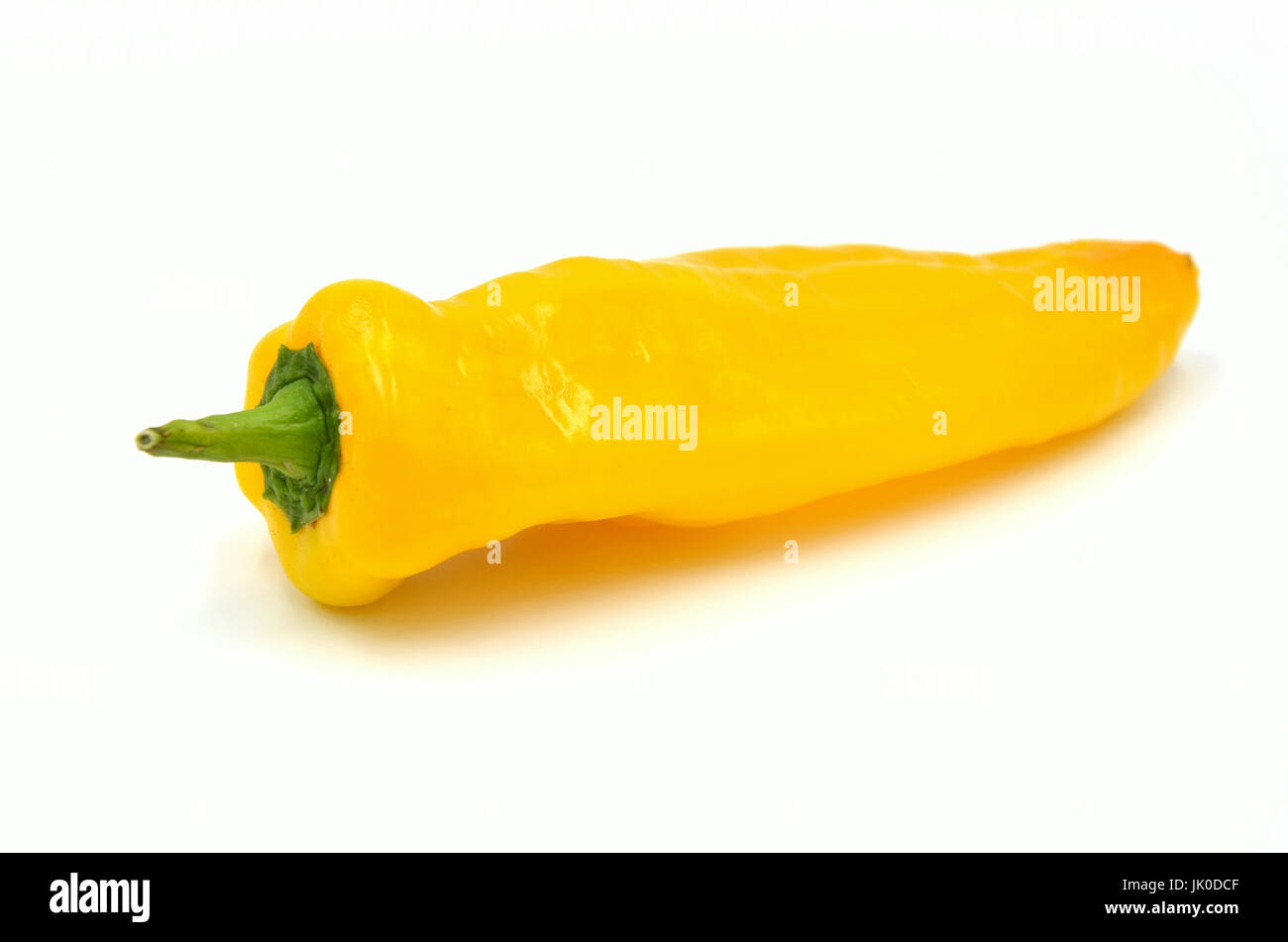 pointed yellow paprika on white Stock Photo - Alamy