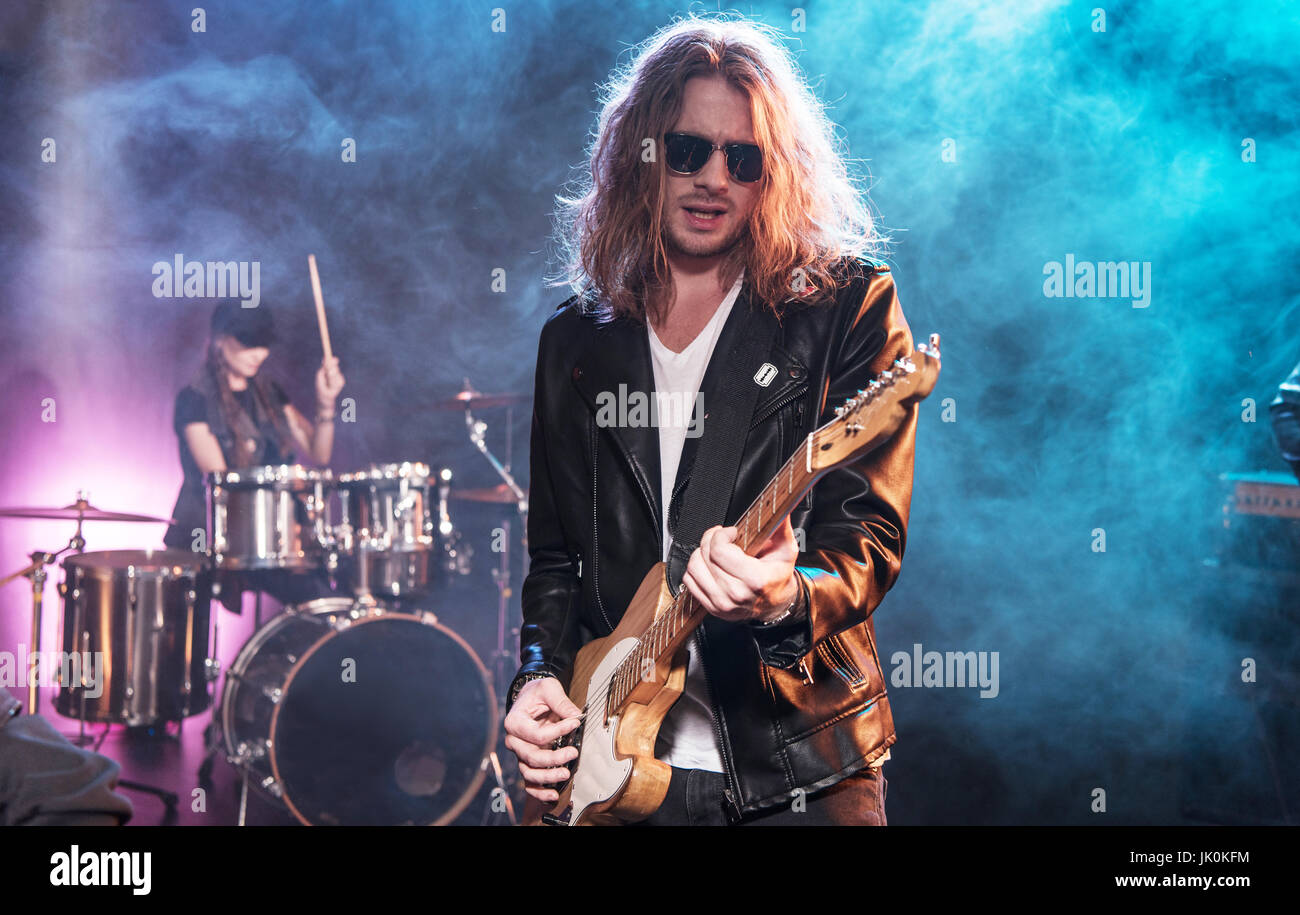 Electric guitar player with rock and roll band performing hard rock ...