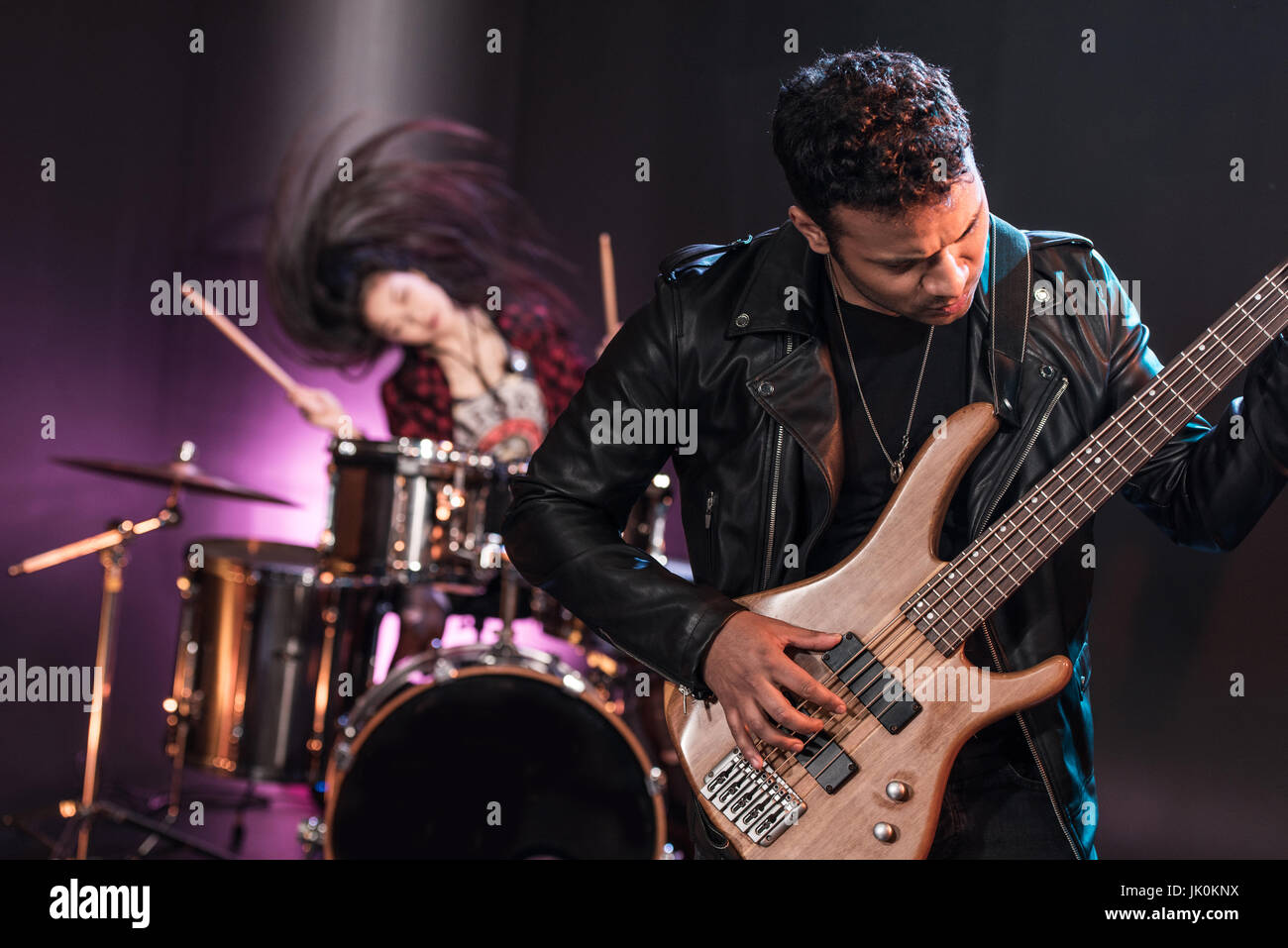 Young electric guitar player performing hard rock music on stage Stock ...