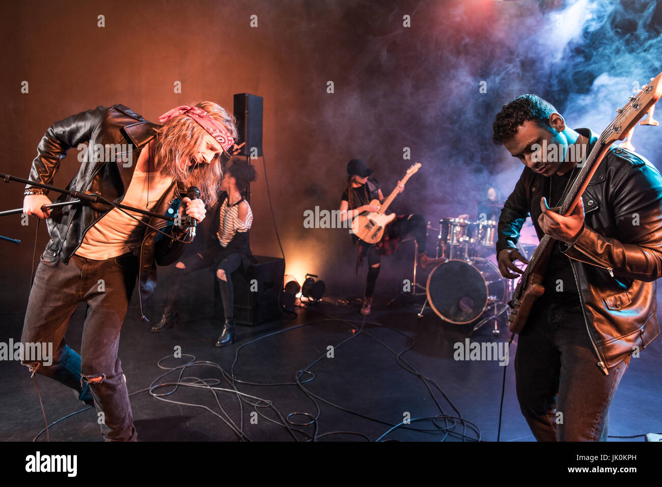 Young group playing rock music hi-res stock photography and images - Alamy