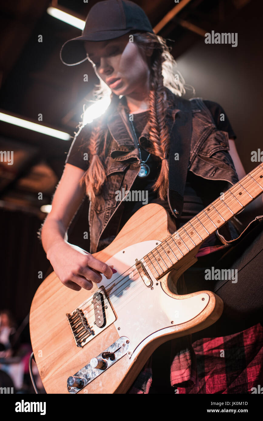 Girl playing bass guitar hi-res stock photography and images - Alamy