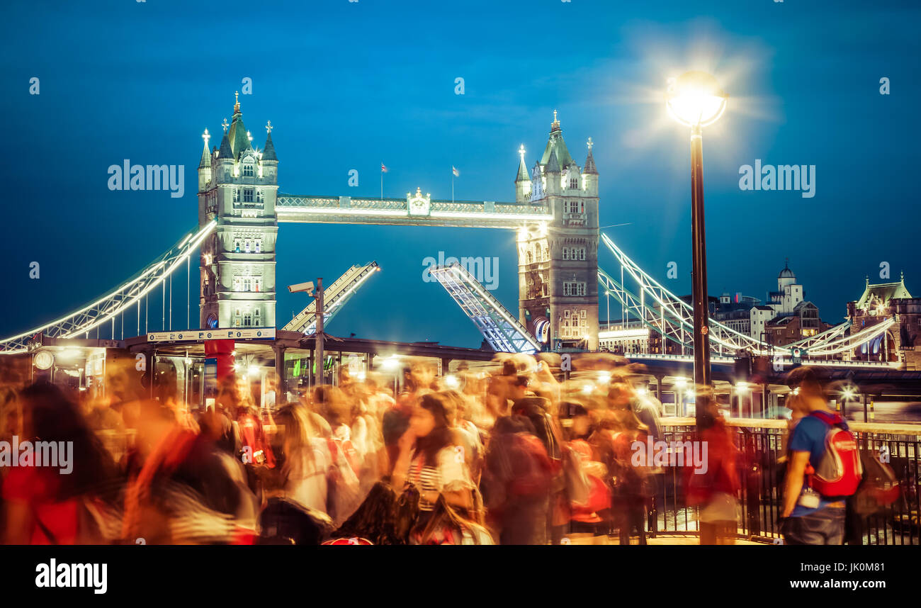 LONDON, UK - JULY 17, 2017: crowd of tourists watching Tower Bridge in ...