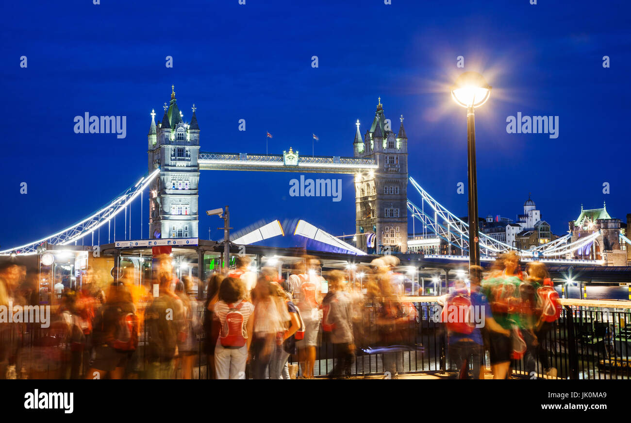 LONDON, UK - JULY 17, 2017: crowd of tourists watching Tower Bridge in ...