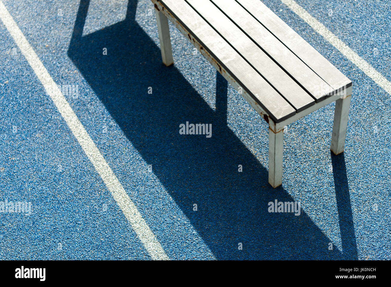 close up view of bench on running track on olympic stadium Stock Photo ...