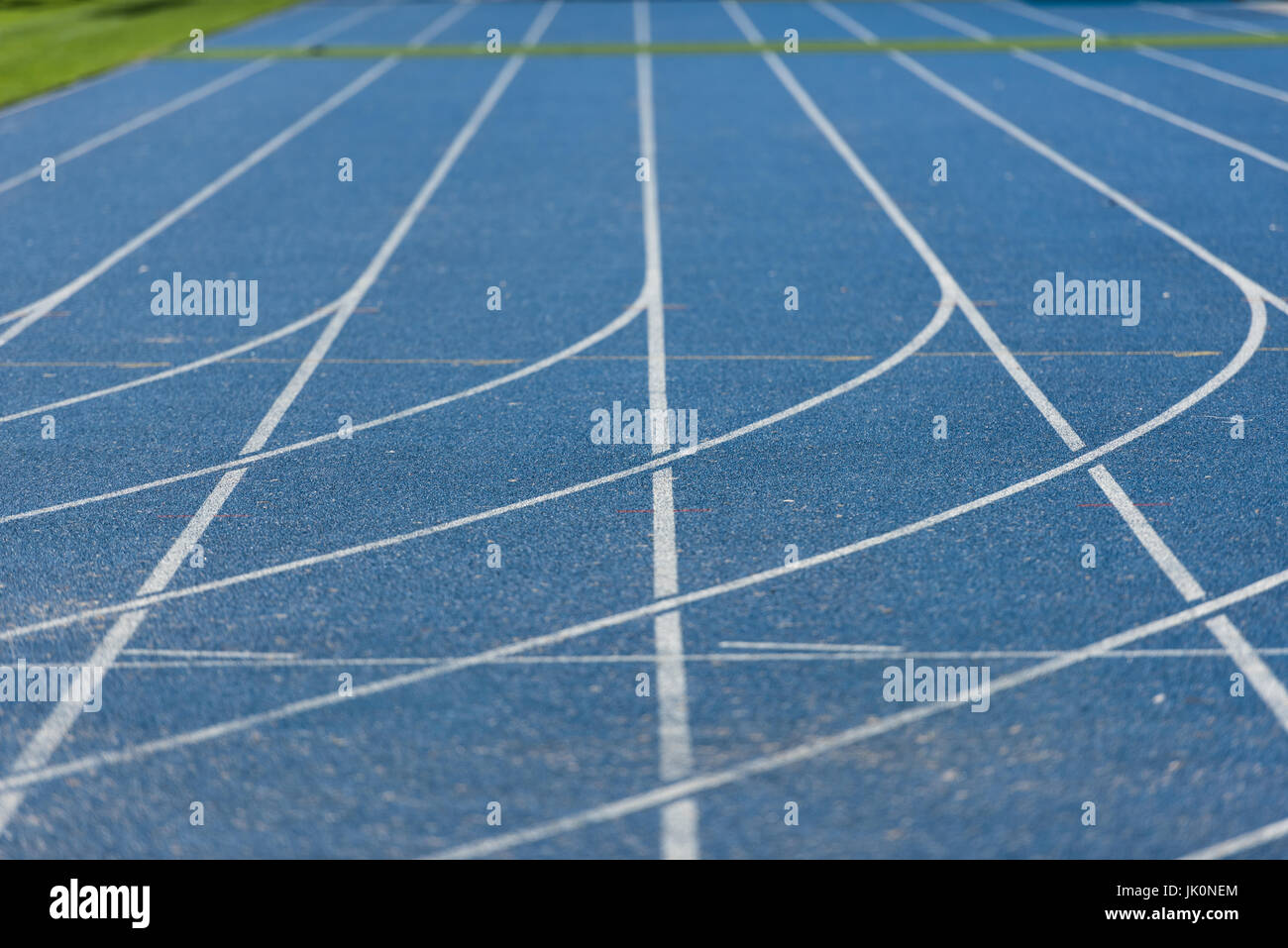 close up view of blue running track on olympic stadium Stock Photo - Alamy