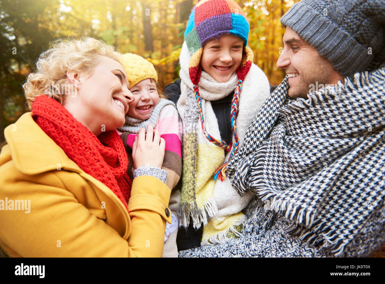Family having fun in the forest Stock Photo - Alamy