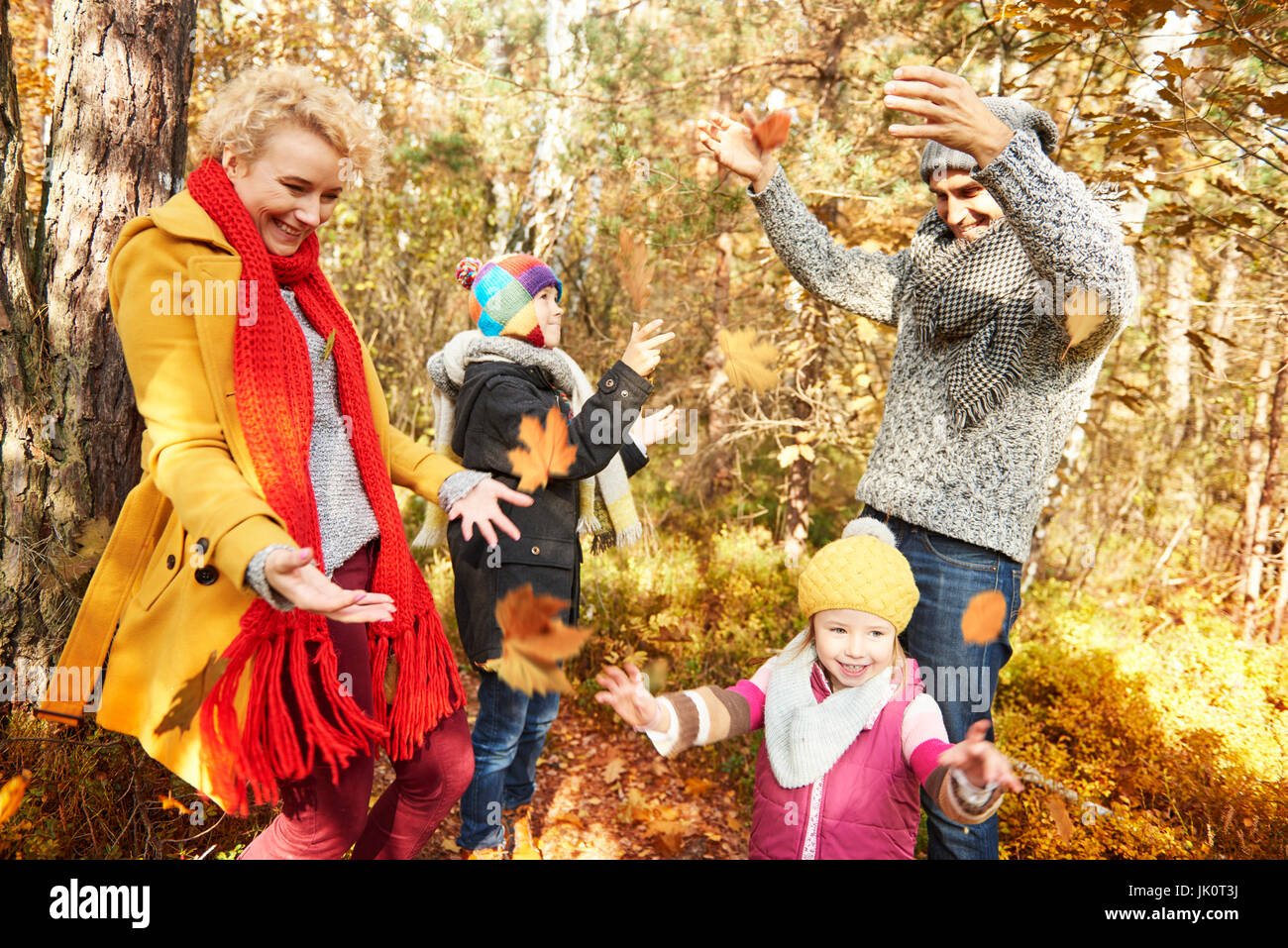 Catching leaves and having fun Stock Photo - Alamy