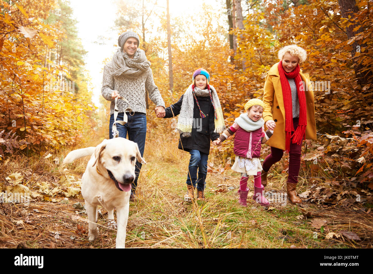 Two generations in autumn background Stock Photo - Alamy
