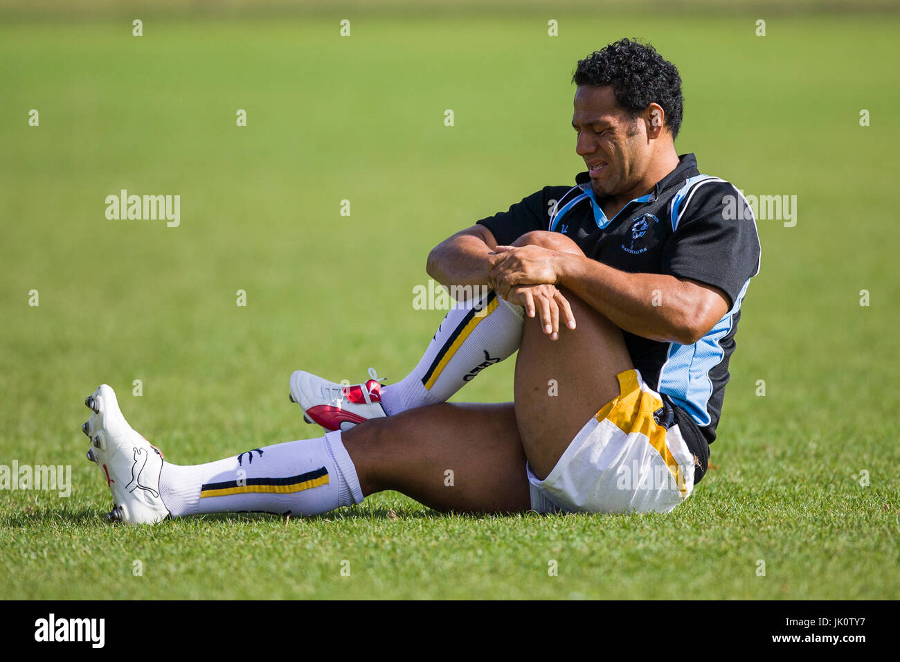 Rugby player stretching quad muscles hi-res stock photography and ...