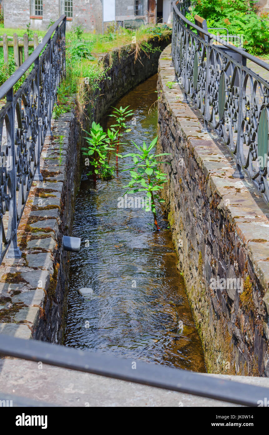 Small river to the water drive of a water mill Stock Photo - Alamy