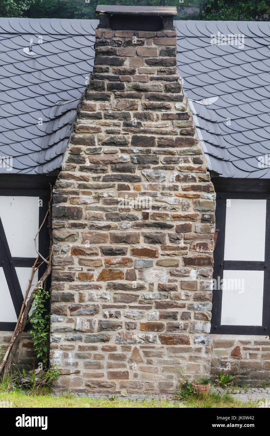 Chimney or natural stone fireplace and dry stone made Stock Photo - Alamy
