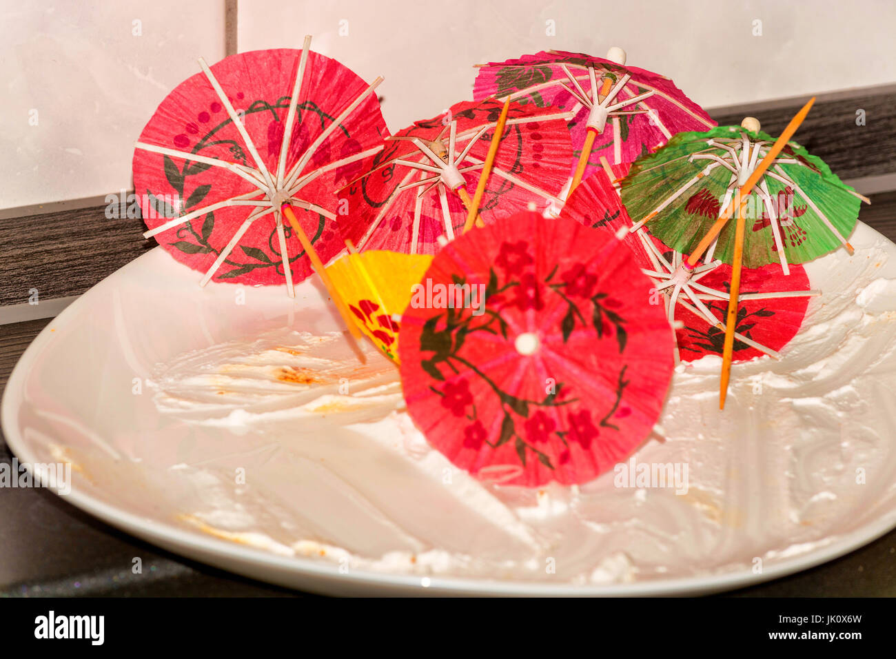 Empty white cake plate, plate on a kitchen plate with colorful paper ...