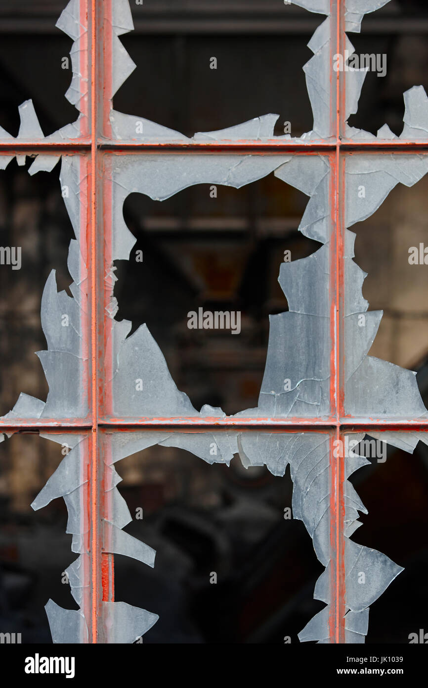Damage window with broken glass and dark background. Vertical Stock ...