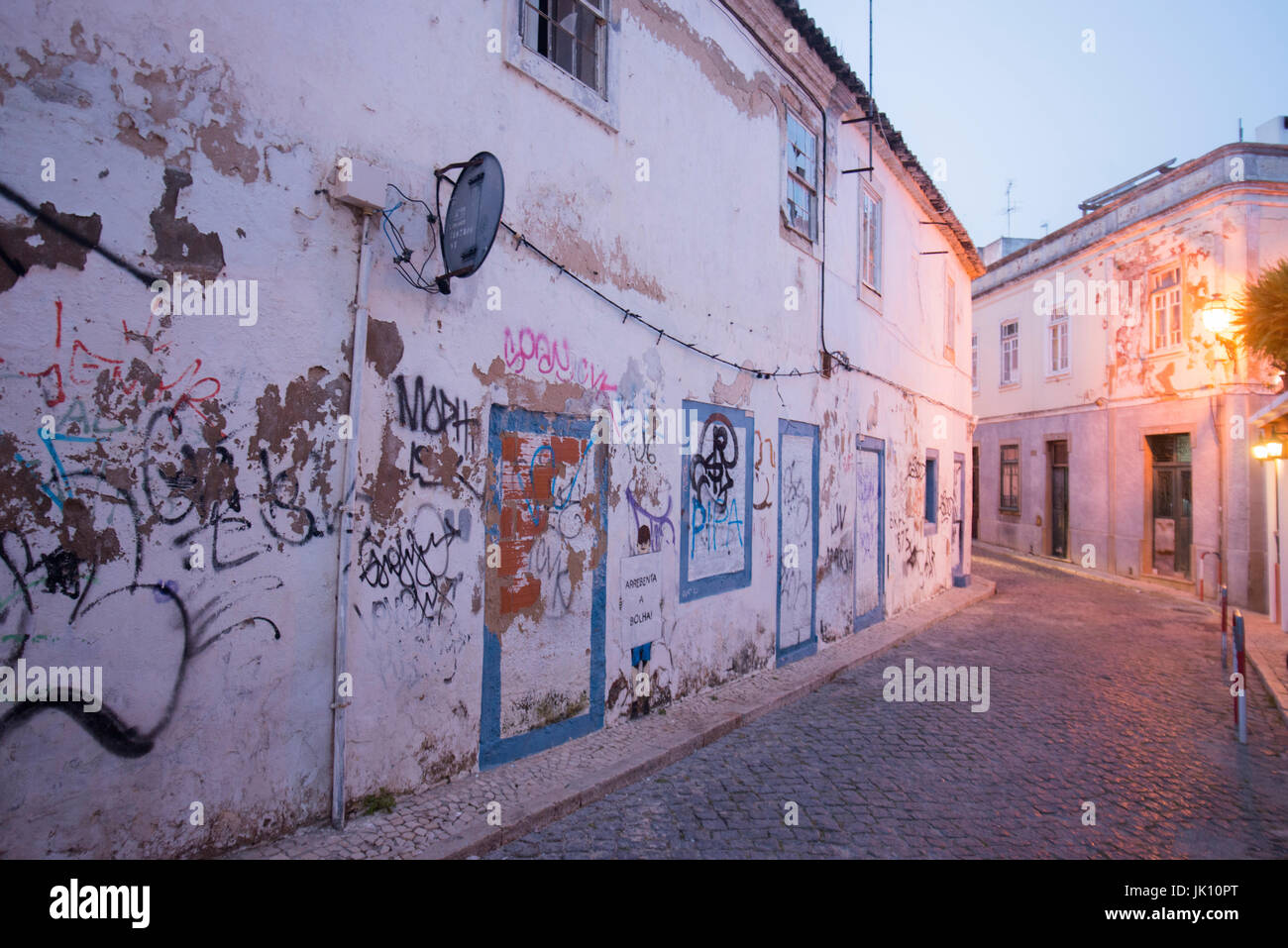 a alley in the old town in the city of Lagos at the Algarve of Portugal ...