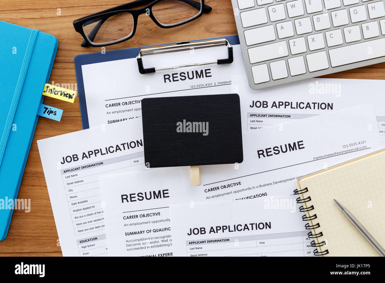 Job search with blank sign and resume and job application on computer ...