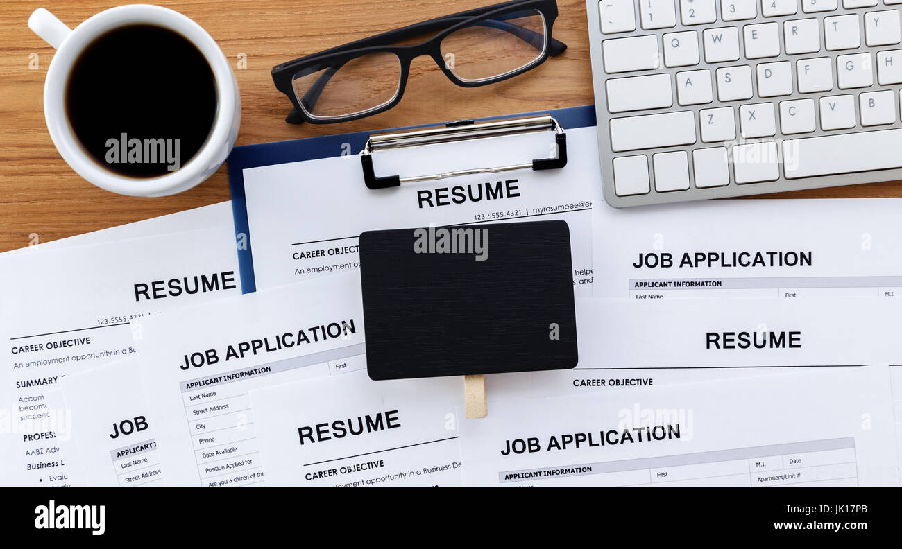 Job search with blank sign and lots of resume and job applications on ...