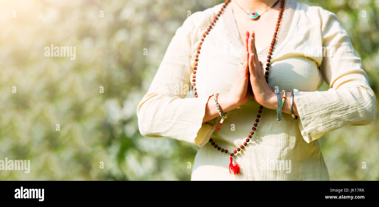 Yoga position in a girl's prayer Stock Photo - Alamy