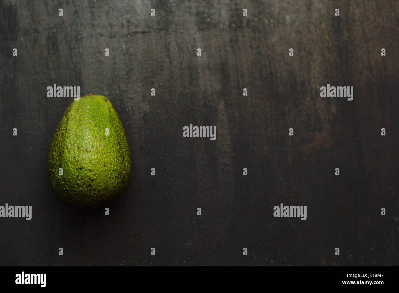 avocado on black background, space for text Stock Photo - Alamy