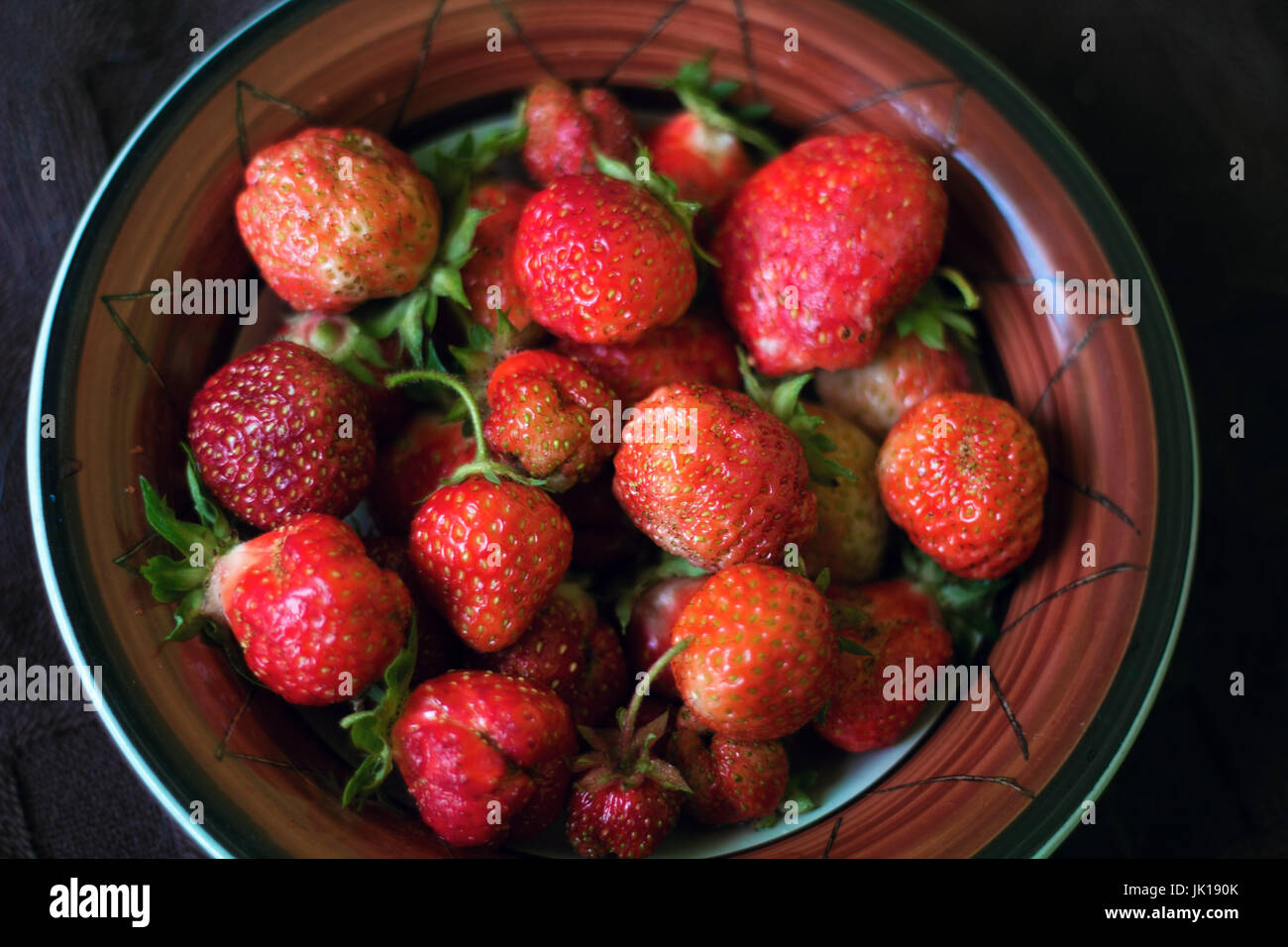a bowl of fresh strawberries top view Stock Photo - Alamy