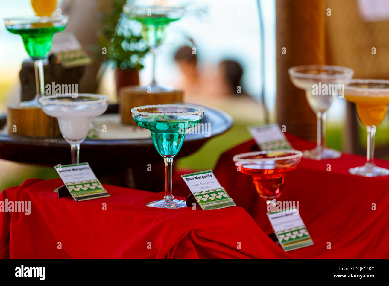 Glasses of color cocktails on pool background Stock Photo - Alamy